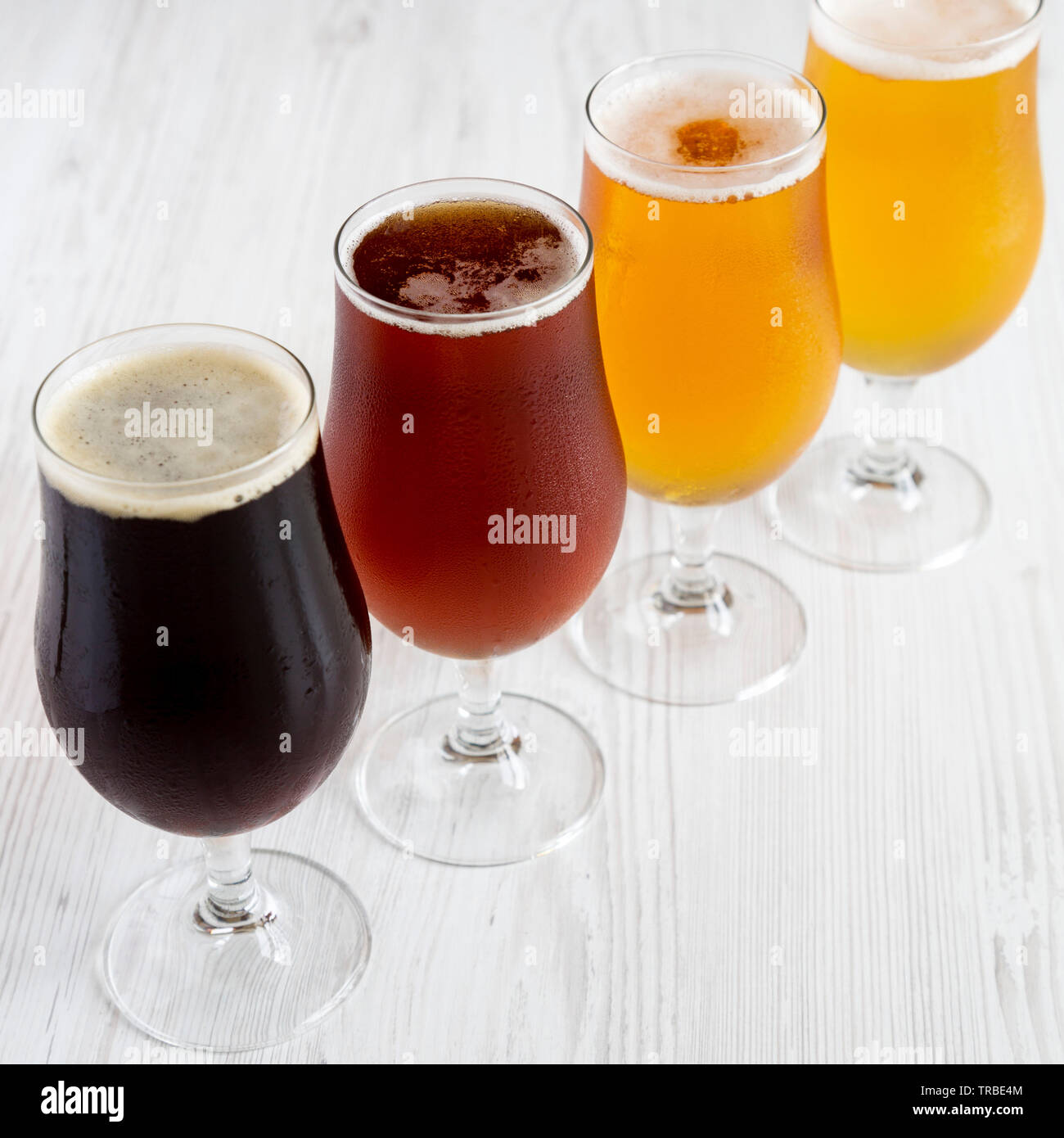 Cold craft beer assortment, side view. Close-up Stock Photo - Alamy