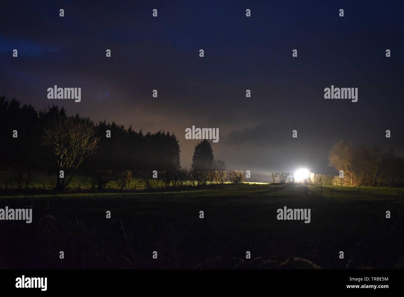 Farmer working late into the night Stock Photo - Alamy