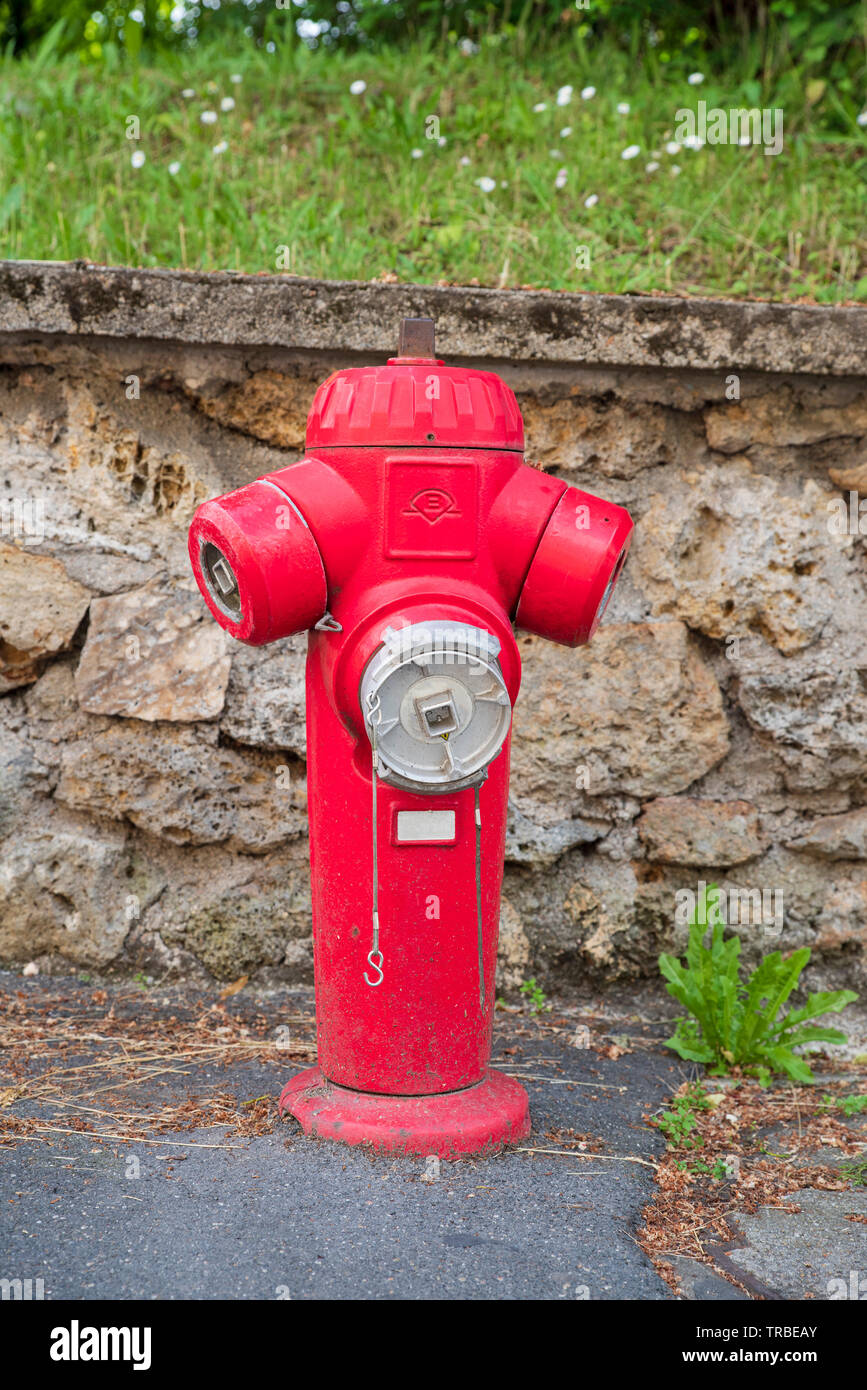 Red fire hydrant in town for firefighters Stock Photo - Alamy