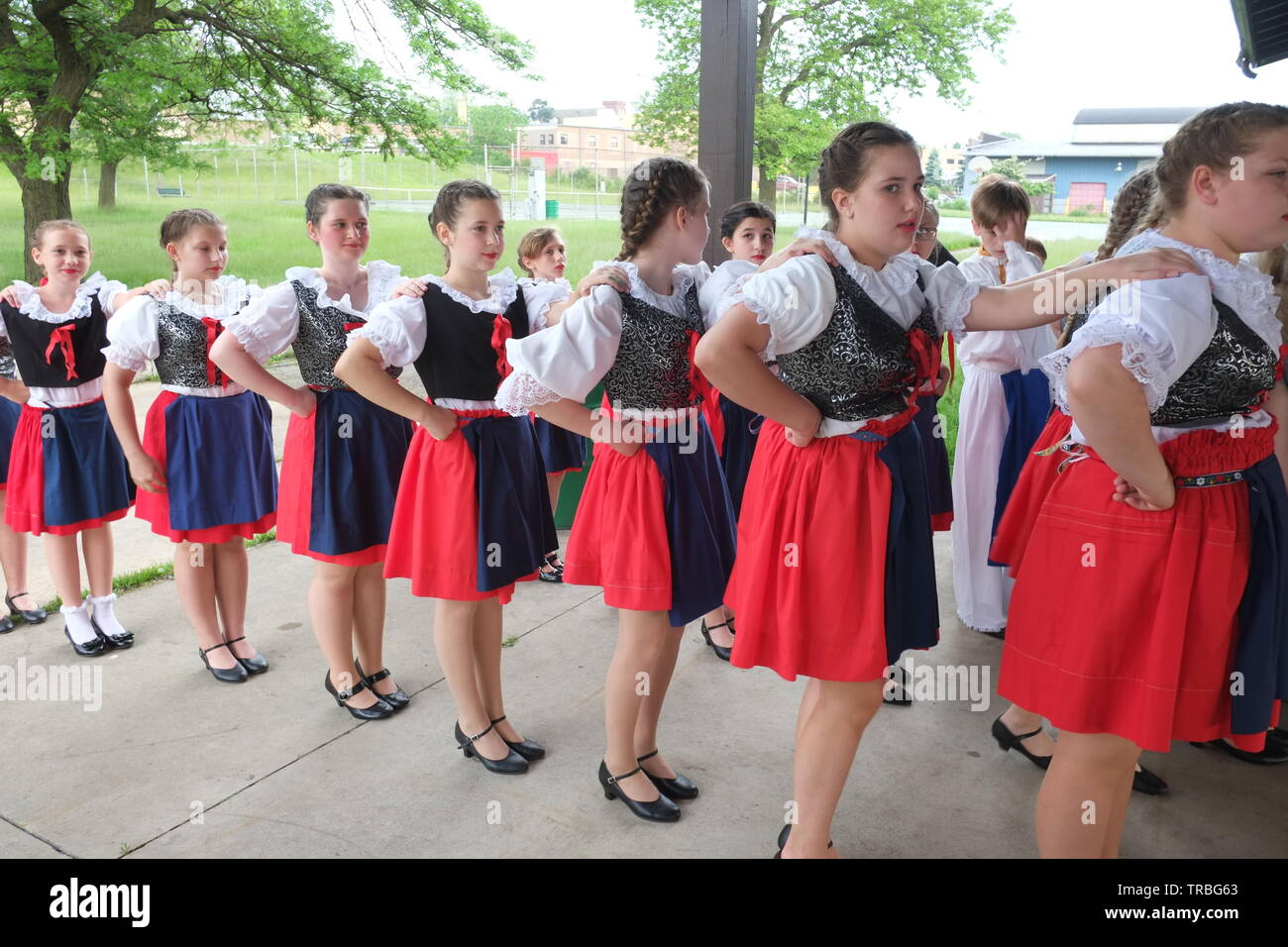 Young women, in traditional folk dresses, prepare for performance Stock ...