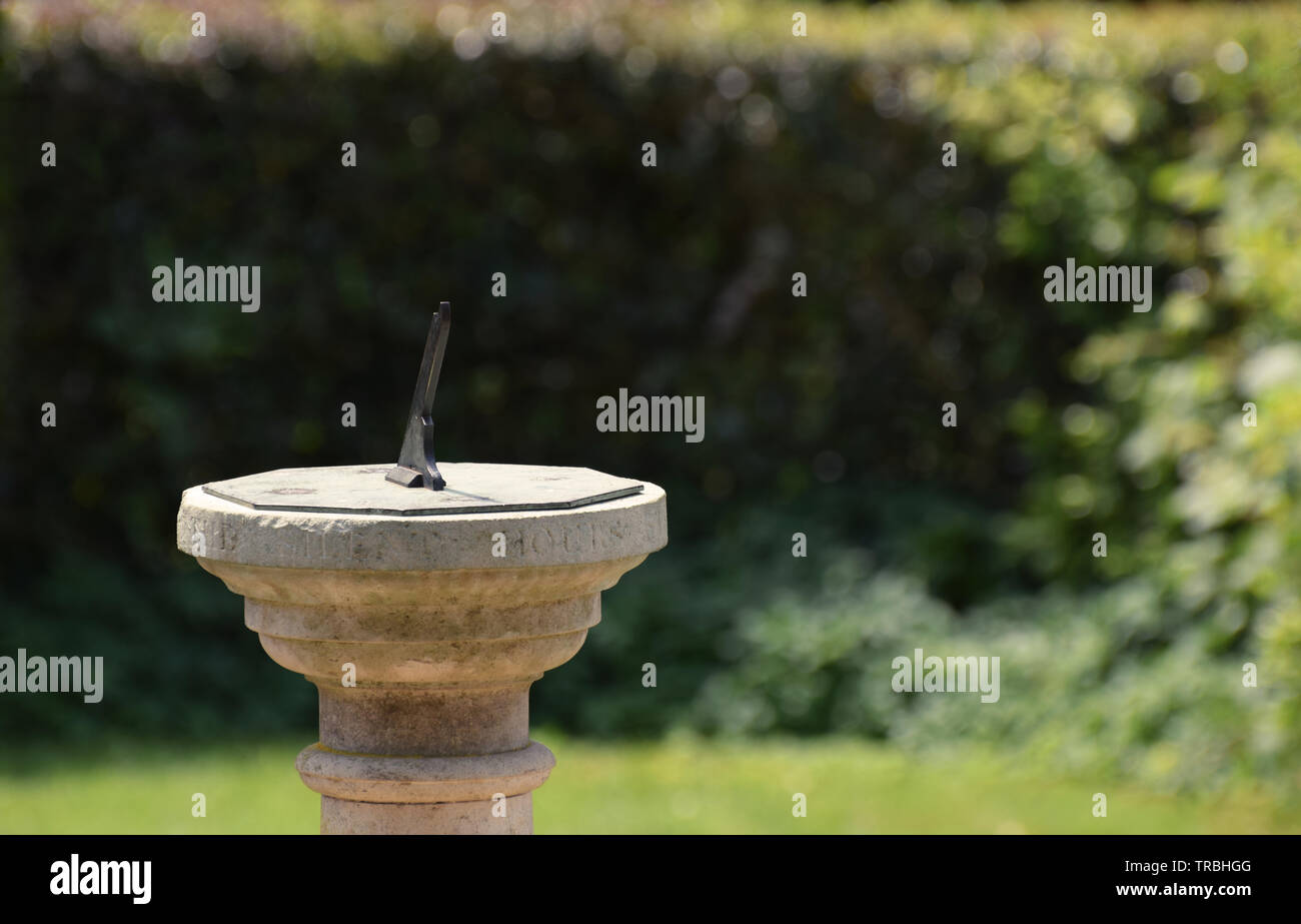 Traditional stone sun dial in an English Garden Stock Photo - Alamy