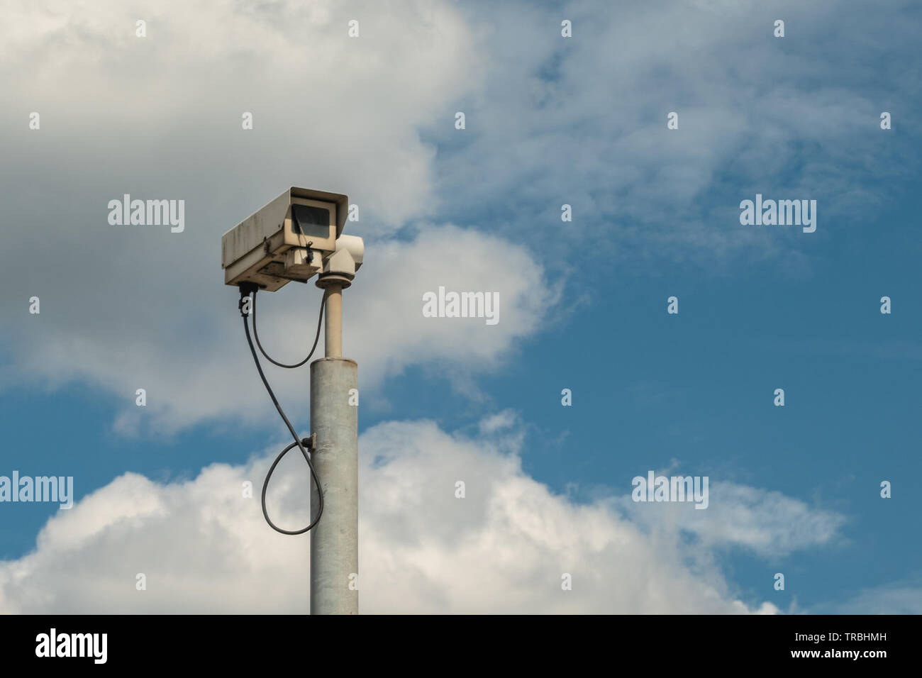 A typical radar trap or speed camera on blue sky Stock Photo - Alamy