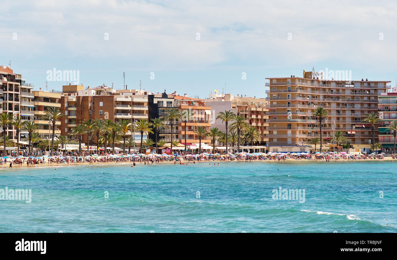 Waterside view blue Mediterranean Sea, vacationers enjoy warm weather ...