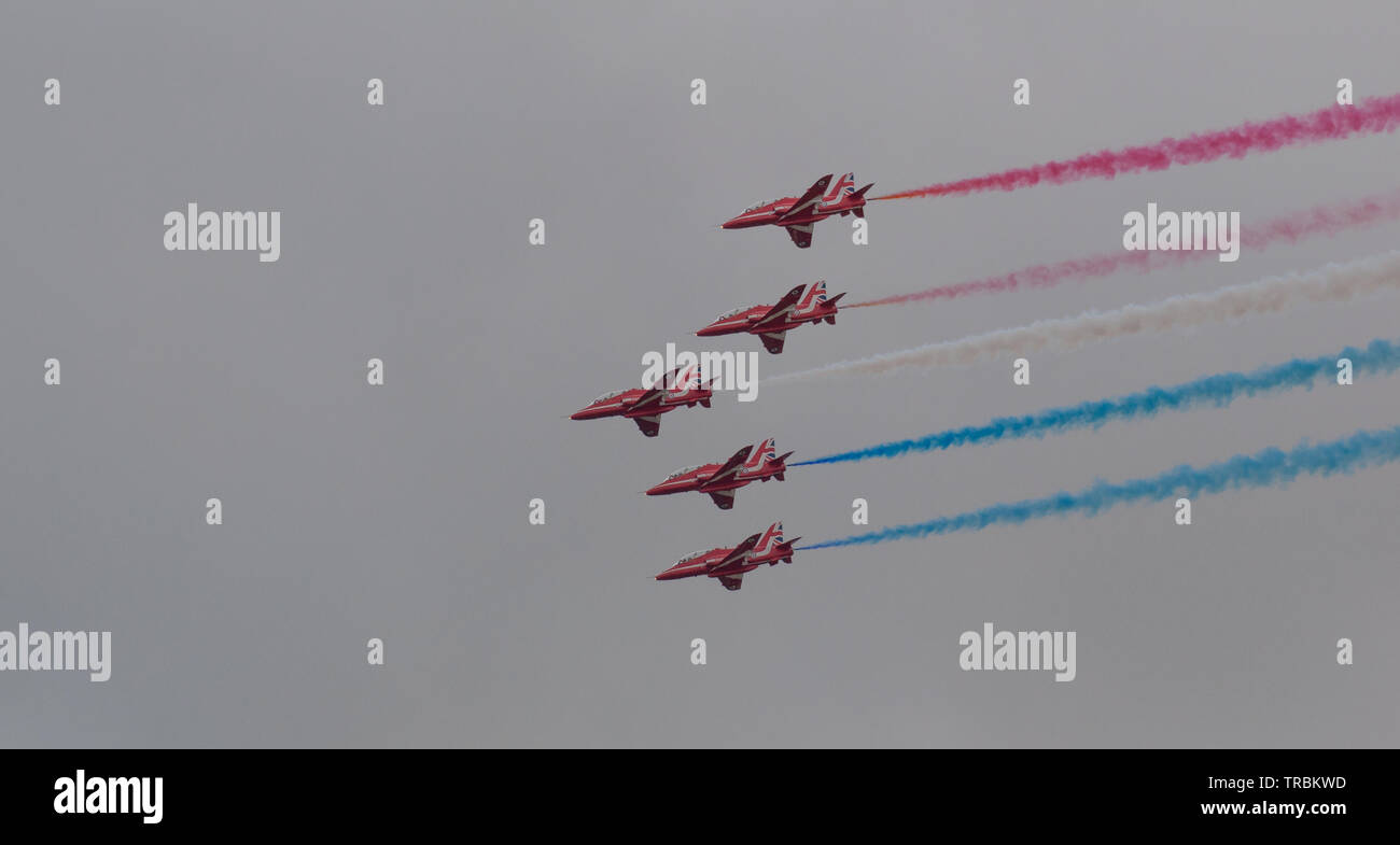 Red Arrows red, white and blue fly-past Stock Photo - Alamy