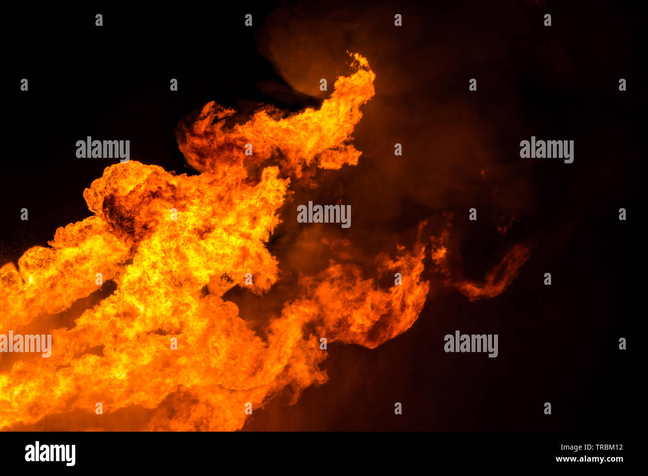 Burning huge crude oil flame Stock Photo - Alamy