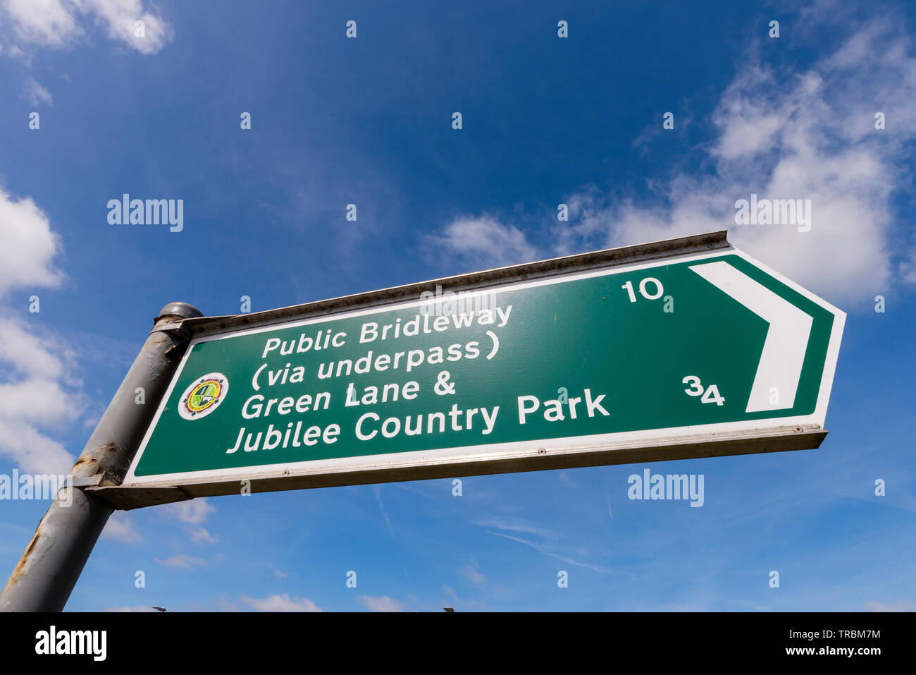Public bridleway to Green Lane & Park direction sign. Green signpost ...