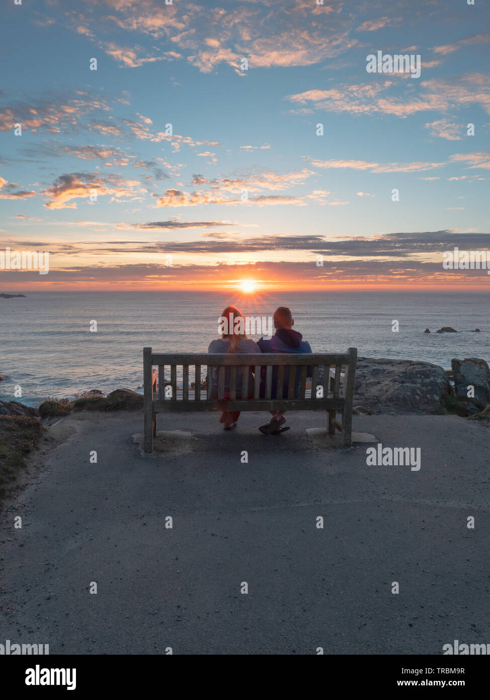 Bench watching sunset hi-res stock photography and images - Alamy