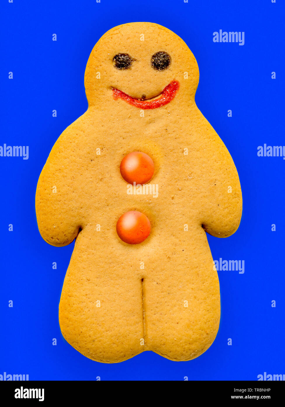 Gingerbread Man on blue background Stock Photo - Alamy