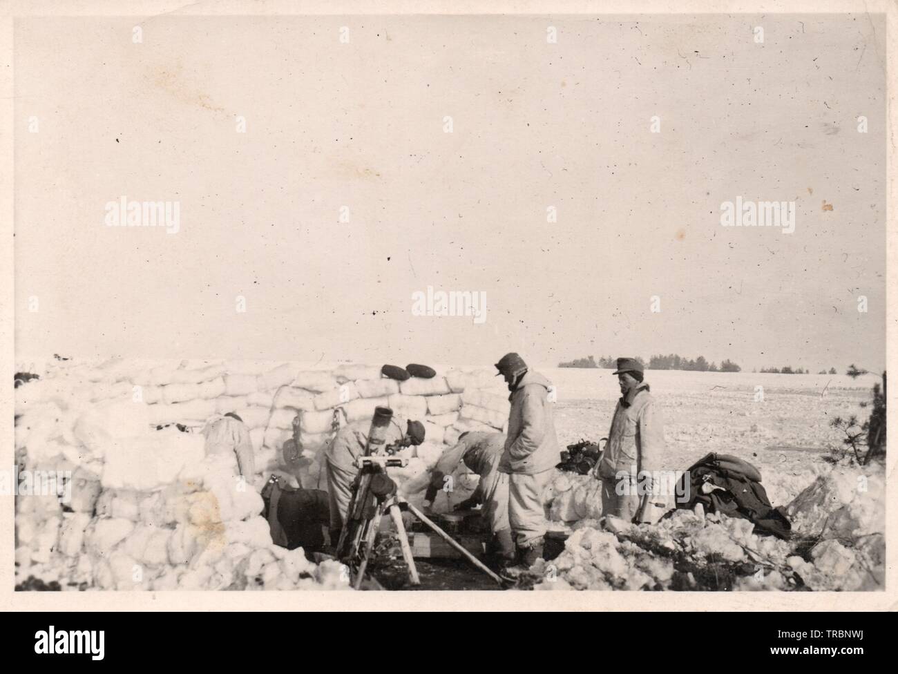 German Soldiers in the winter snow dressed in White camouflage with a ...
