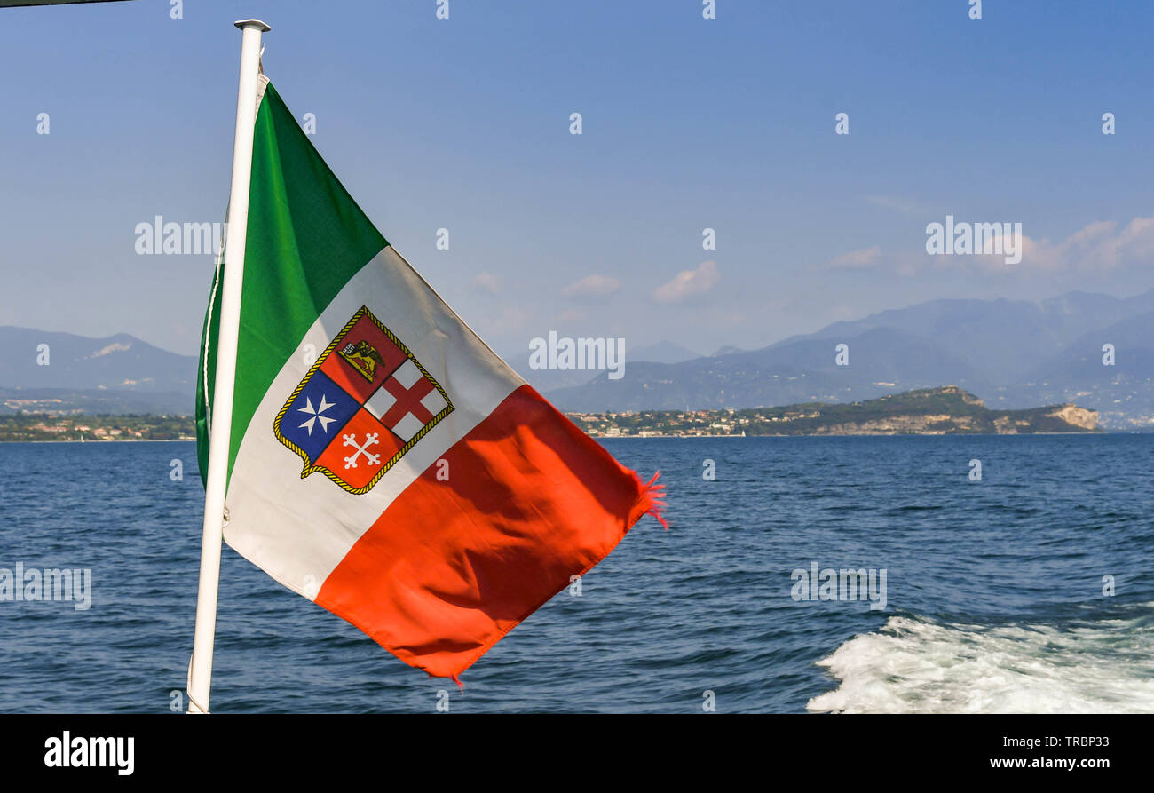 LAKE GARDA, ITALY - SEPTEMBER 2018: Flag flying from the back of a ...