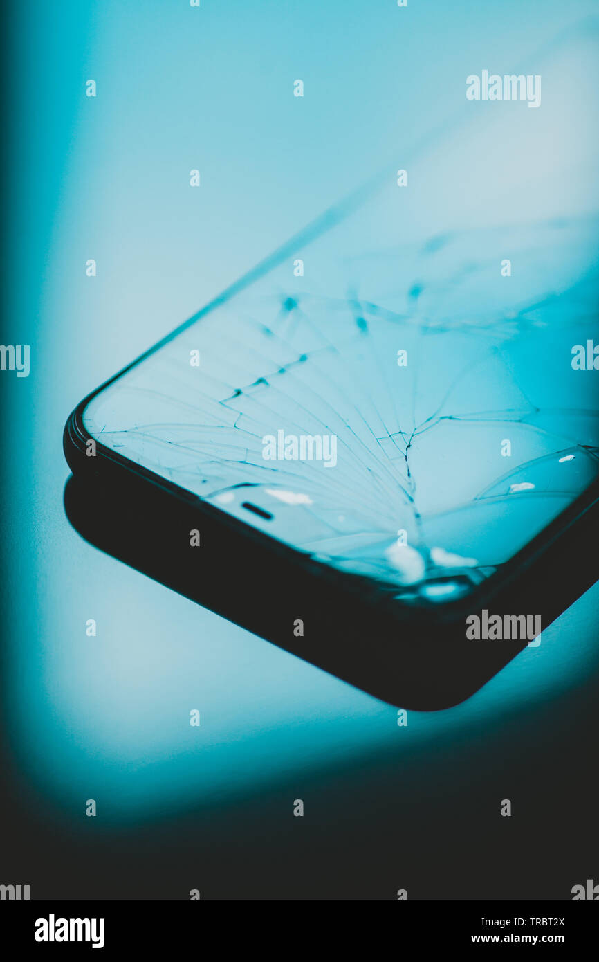 Phone with broken touchscreen screen on black table desktop Stock Photo ...