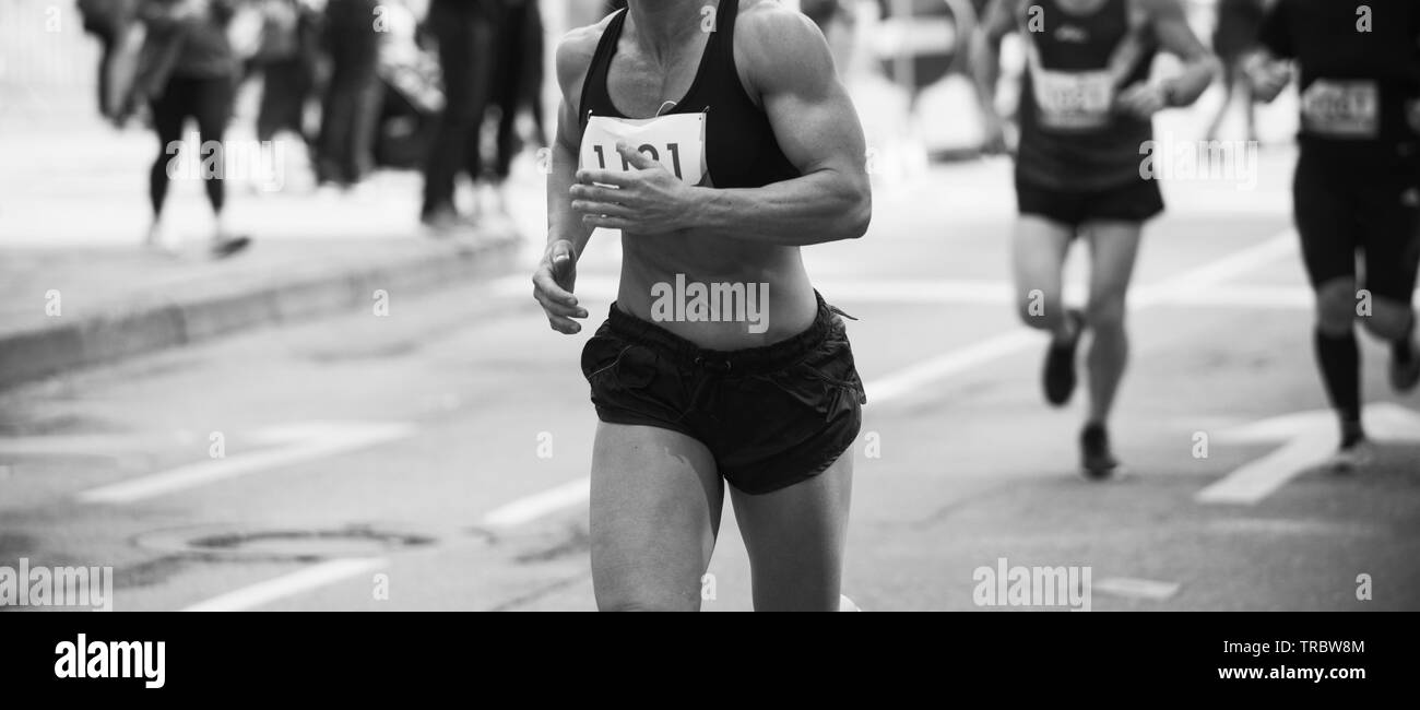 Unrecognizable muscular runner outdoors. Long distance running. Black ...