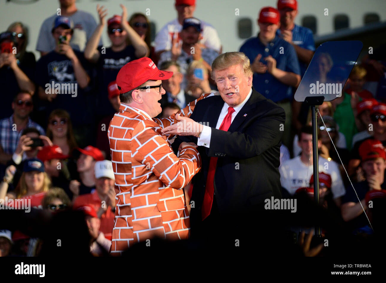 US President Donald J. Trump greets Blake Marnell on stage after being ...