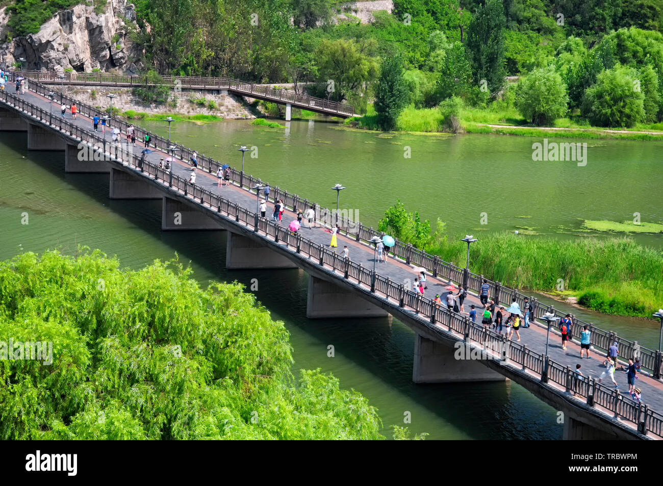 August 15, 2015. Luoyang, China. Chinese tourists walking over the ...