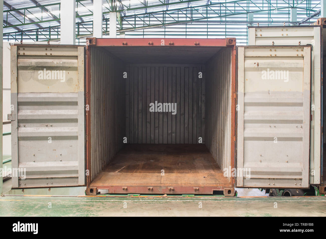 The container inside warehouse on shipment area Stock Photo - Alamy
