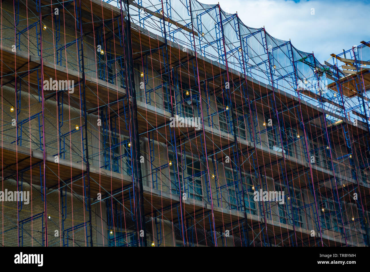 Construction scaffolding around the high school Stock Photo - Alamy