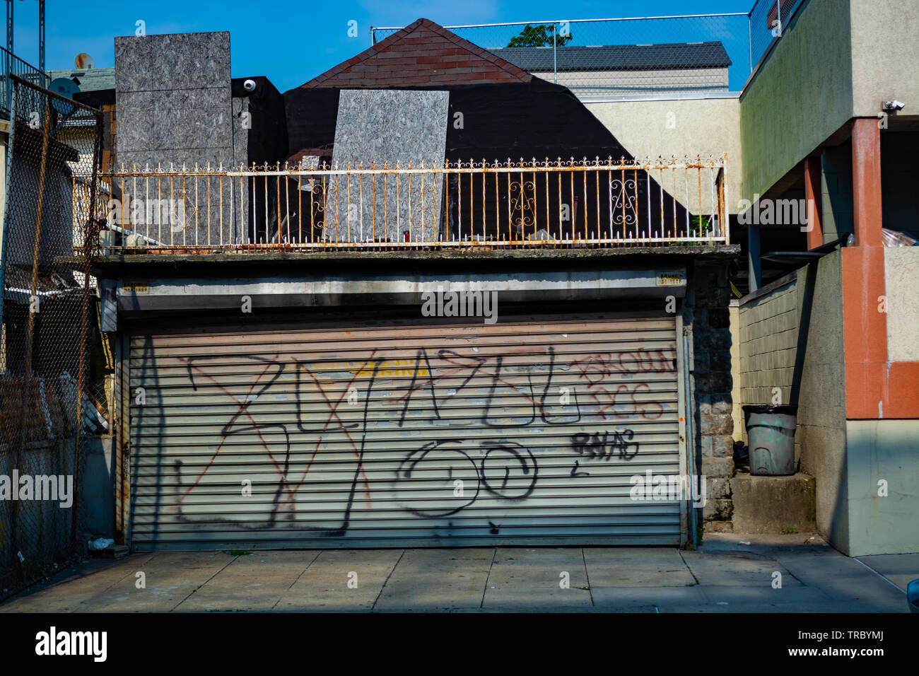 Graffiti on a metal garage door of the house Stock Photo - Alamy