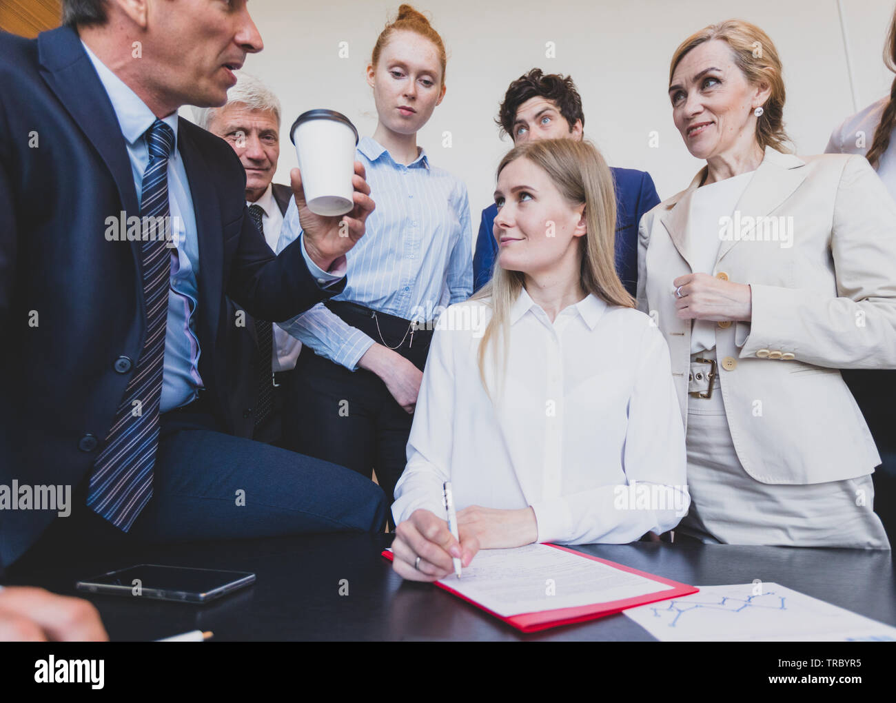 Business people at work on stock market charts in office , meeting ...