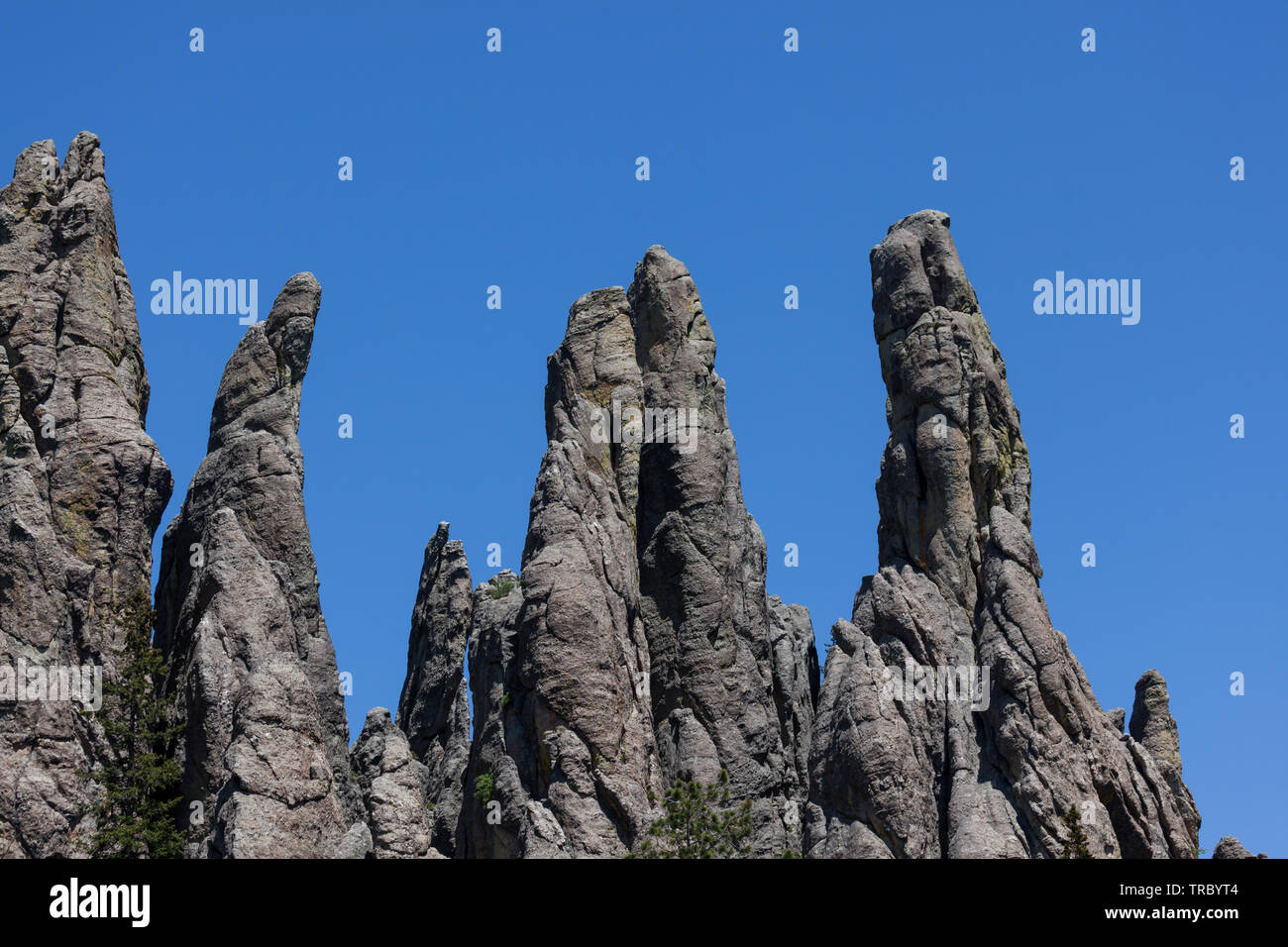 Enormous rock formations against a brilliant blue sky in the Cathedral ...
