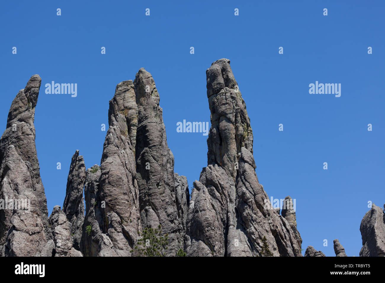 Enormous rock formations against a brilliant blue sky in the Cathedral ...