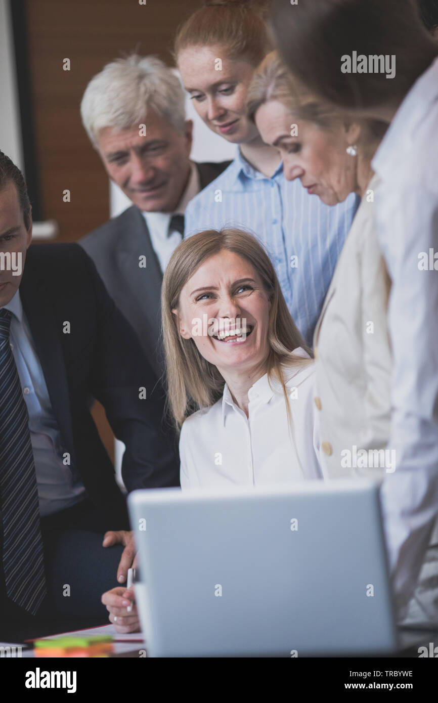 Business team interacting at meeting Focus on happy laughing woman , joy , success, unity ...