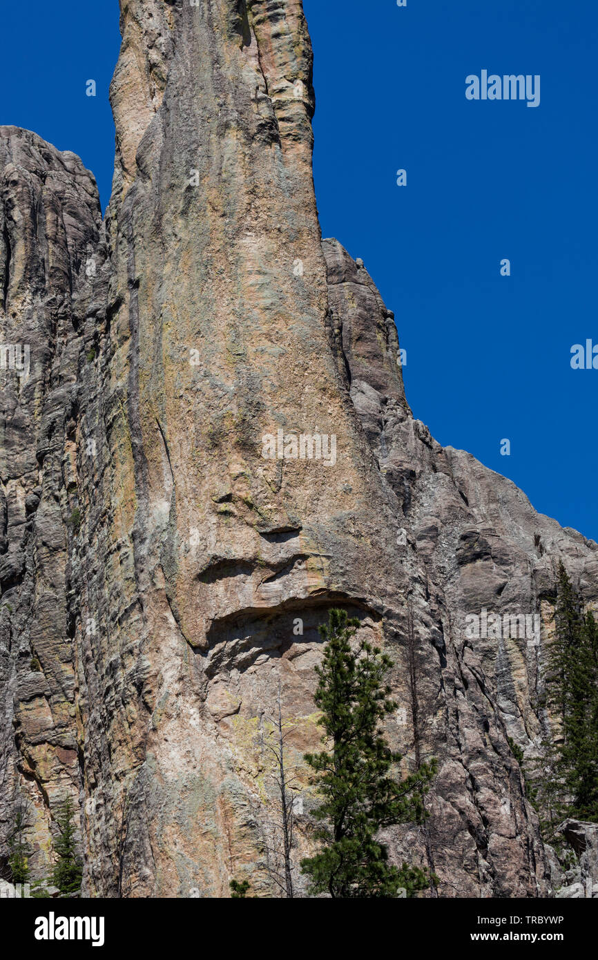 Enormous rock formations against a blue sky in the Cathedral Spires ...