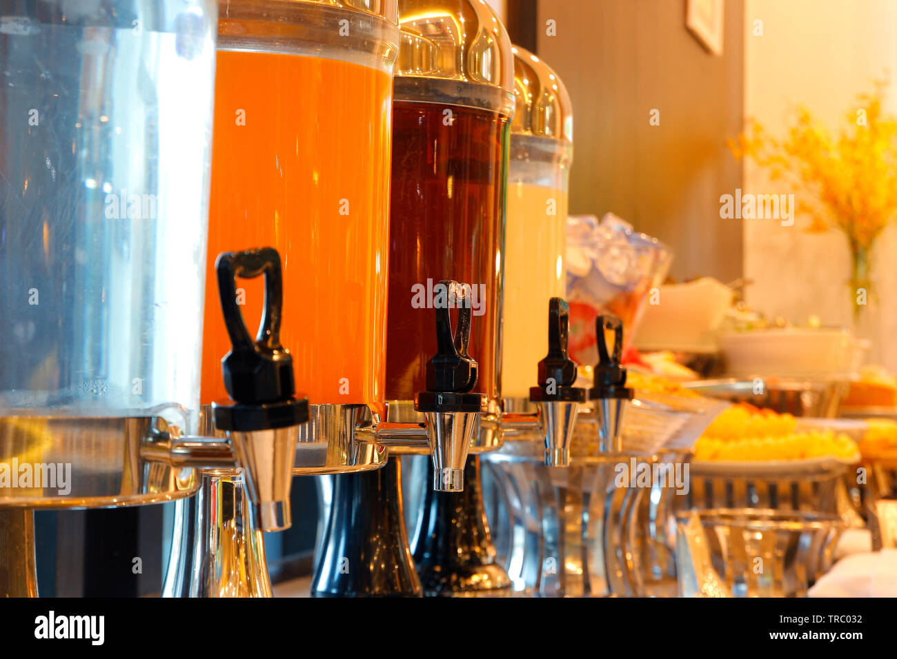 photo of juice and water in bottles on buffet line Stock Photo - Alamy