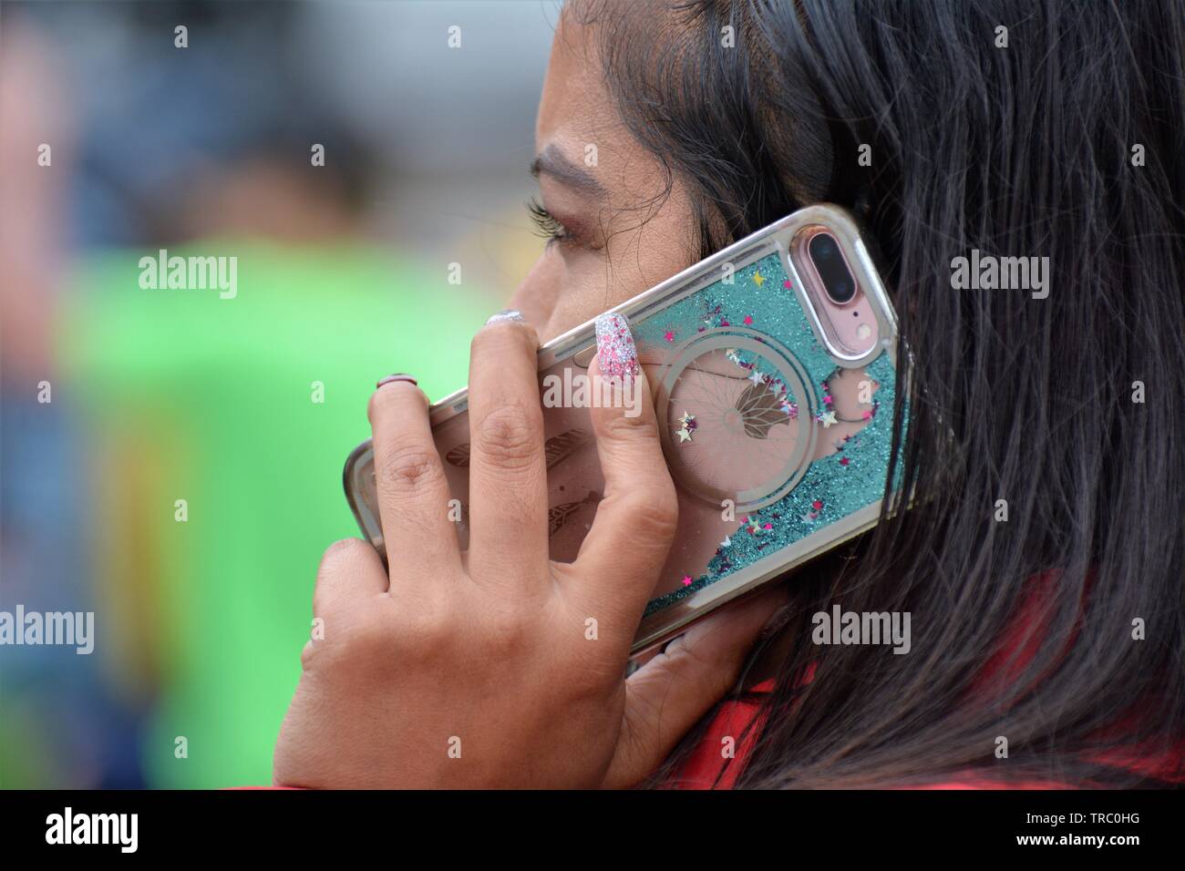 Latina women on phone talking photos photo pictures and videoing family ...