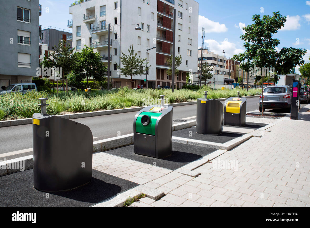 Waste bins in a city centre of Massy in France in front of a building ...