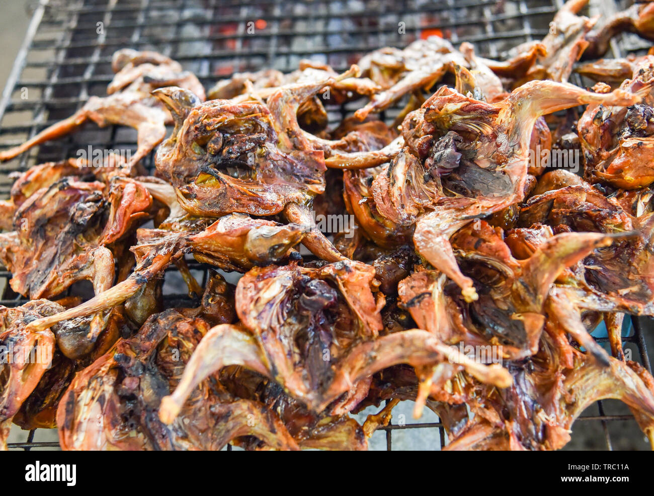 Grilled quail on the grill grate / marinated of roasted quail bird for ...