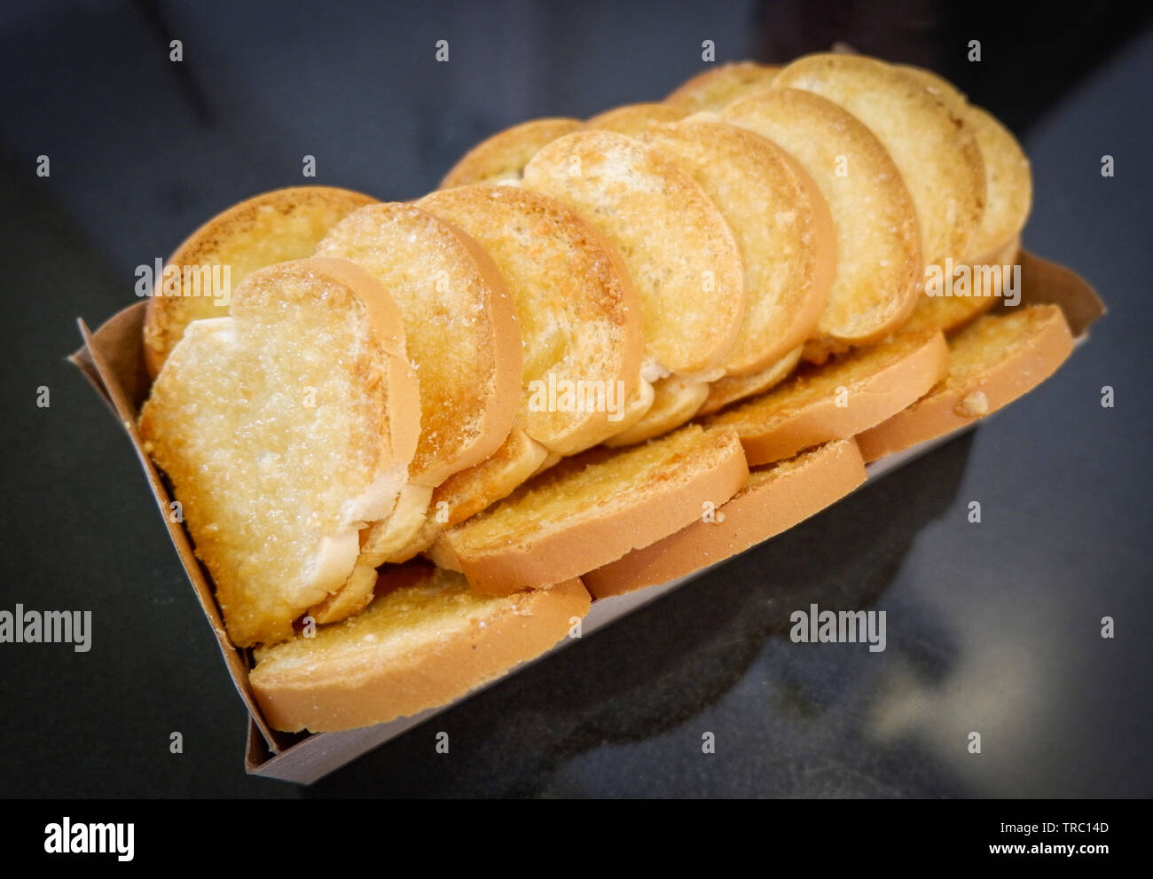 toast bread with sugar on dark table for breakfast Stock Photo - Alamy