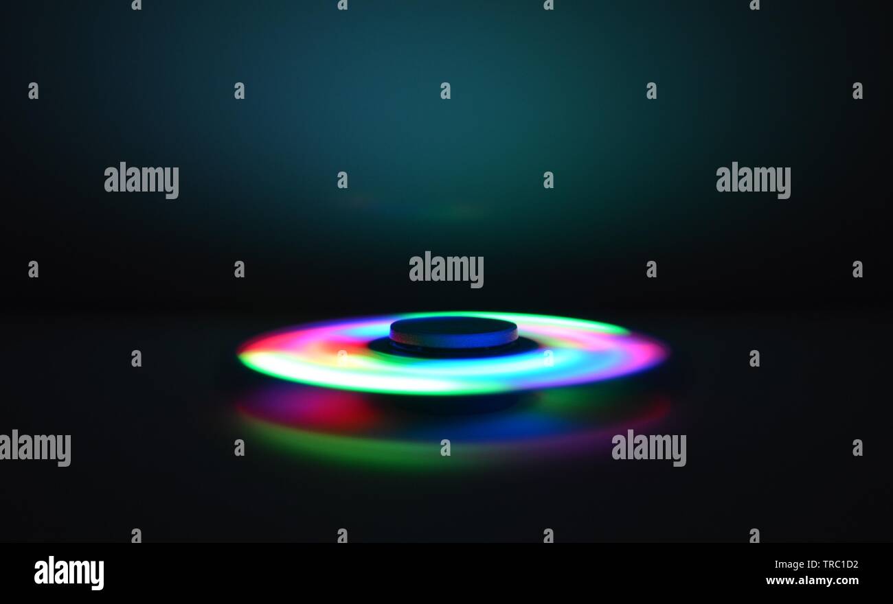 Fidget spinner rotation forming circle of light, long exposure ...