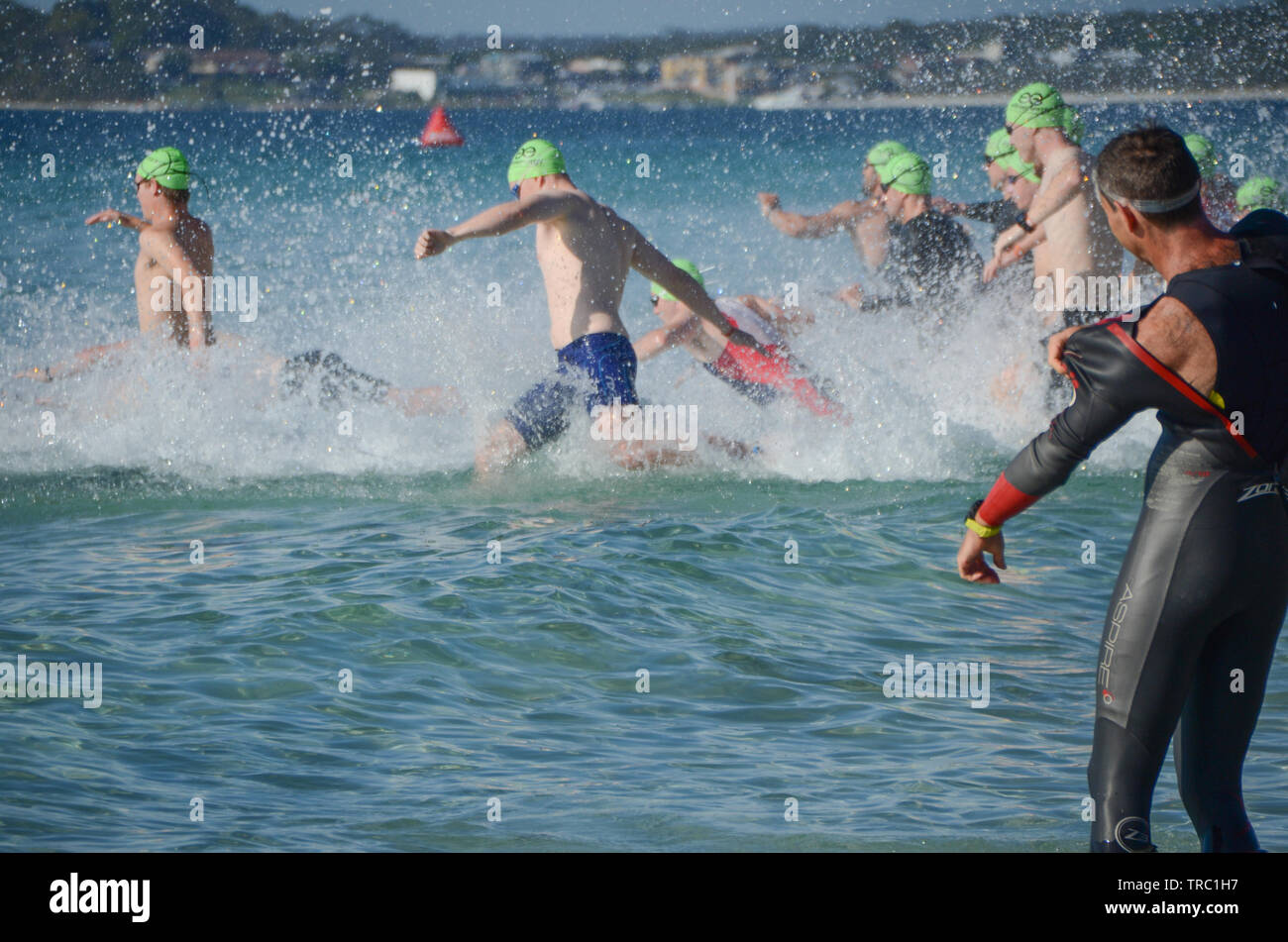Run into ocean beach wetsuit hi-res stock photography and images - Alamy