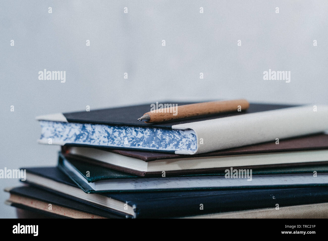 Books and Pencil Stock Photo - Alamy