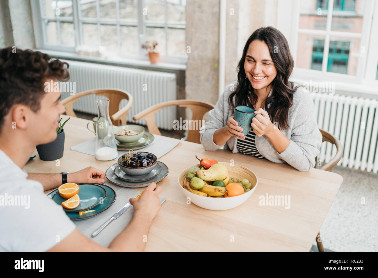 Young Woman breakfast in the kitchen Stock Photo - Alamy