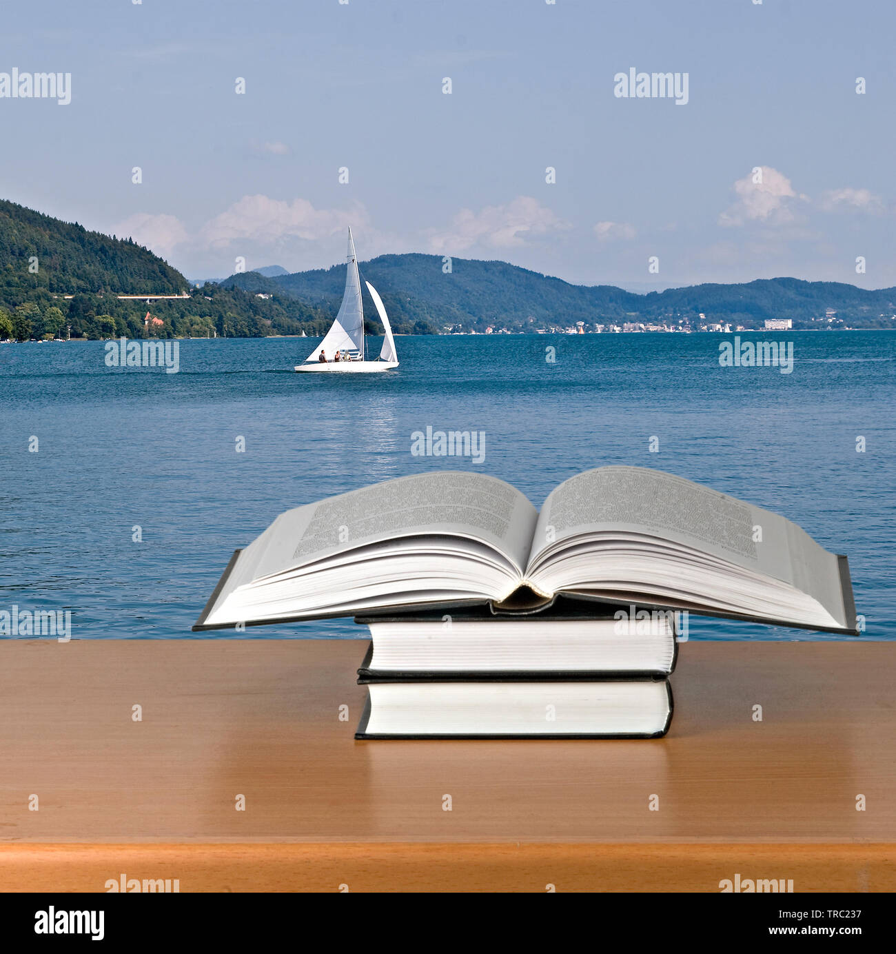 Open book on desk Stock Photo - Alamy