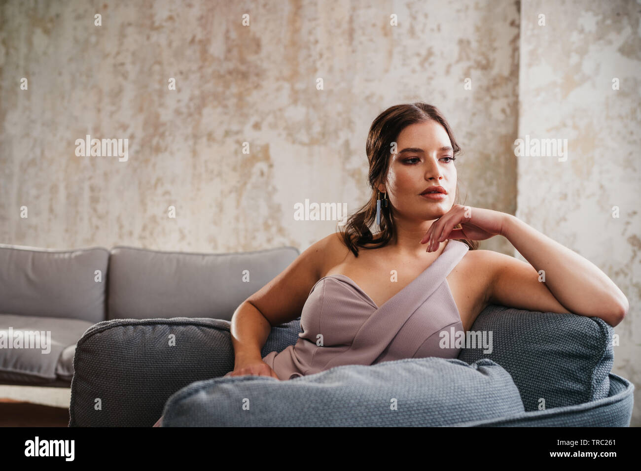 Beautiful woman on couch hi-res stock photography and images - Alamy