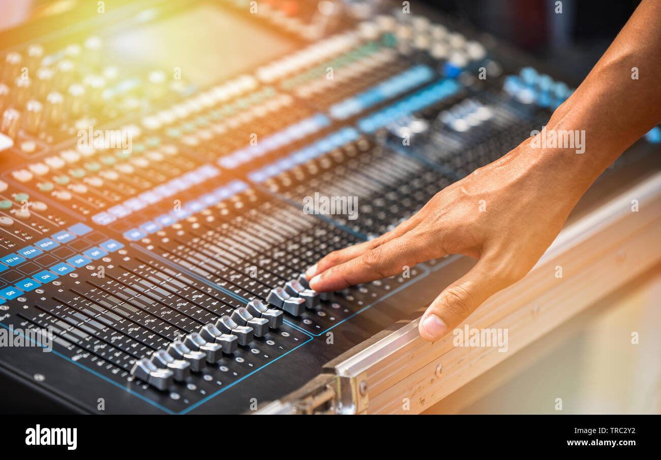 Professional audio mix sound control panel console with hand / Sound ...