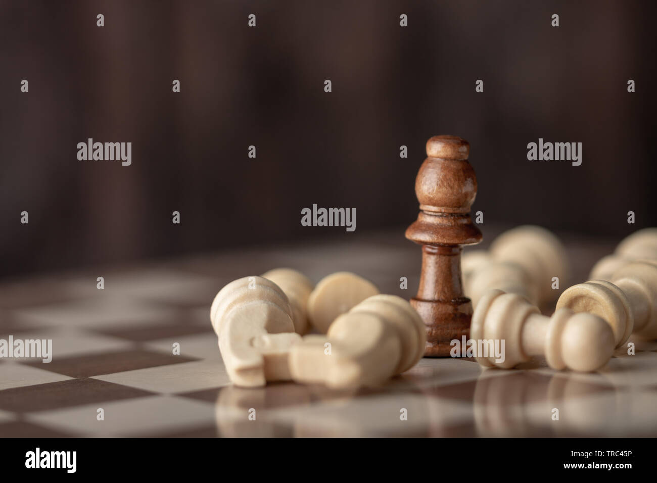 Wooden queen standing in the midst of falling chess on board Stock ...