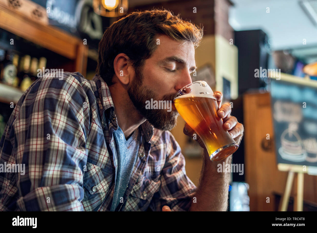 Man drinking beer Stock Photo - Alamy