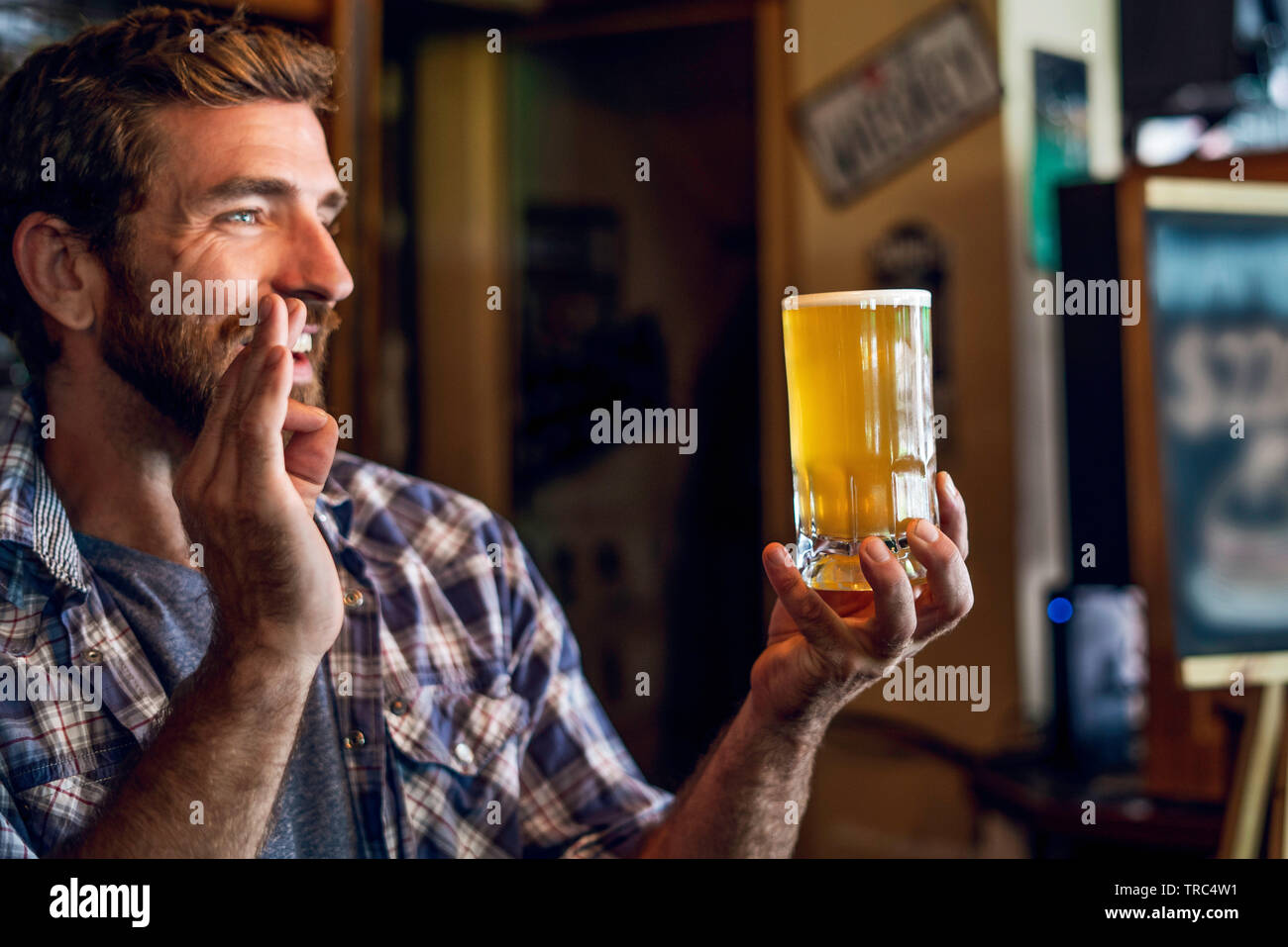 Man with beer mug showing a hand sign Stock Photo - Alamy