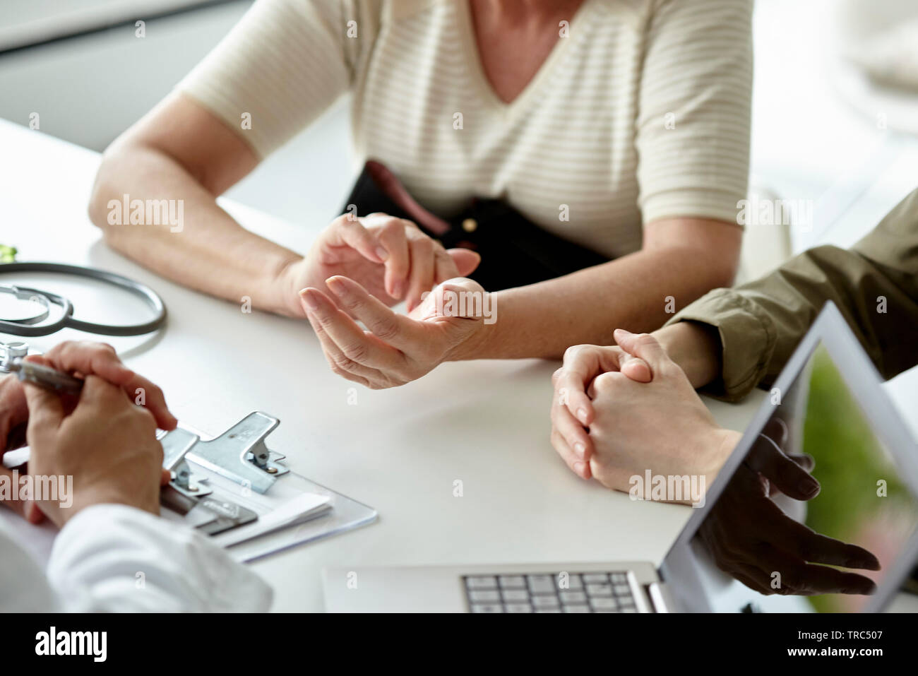Patient talking with doctor Stock Photo - Alamy