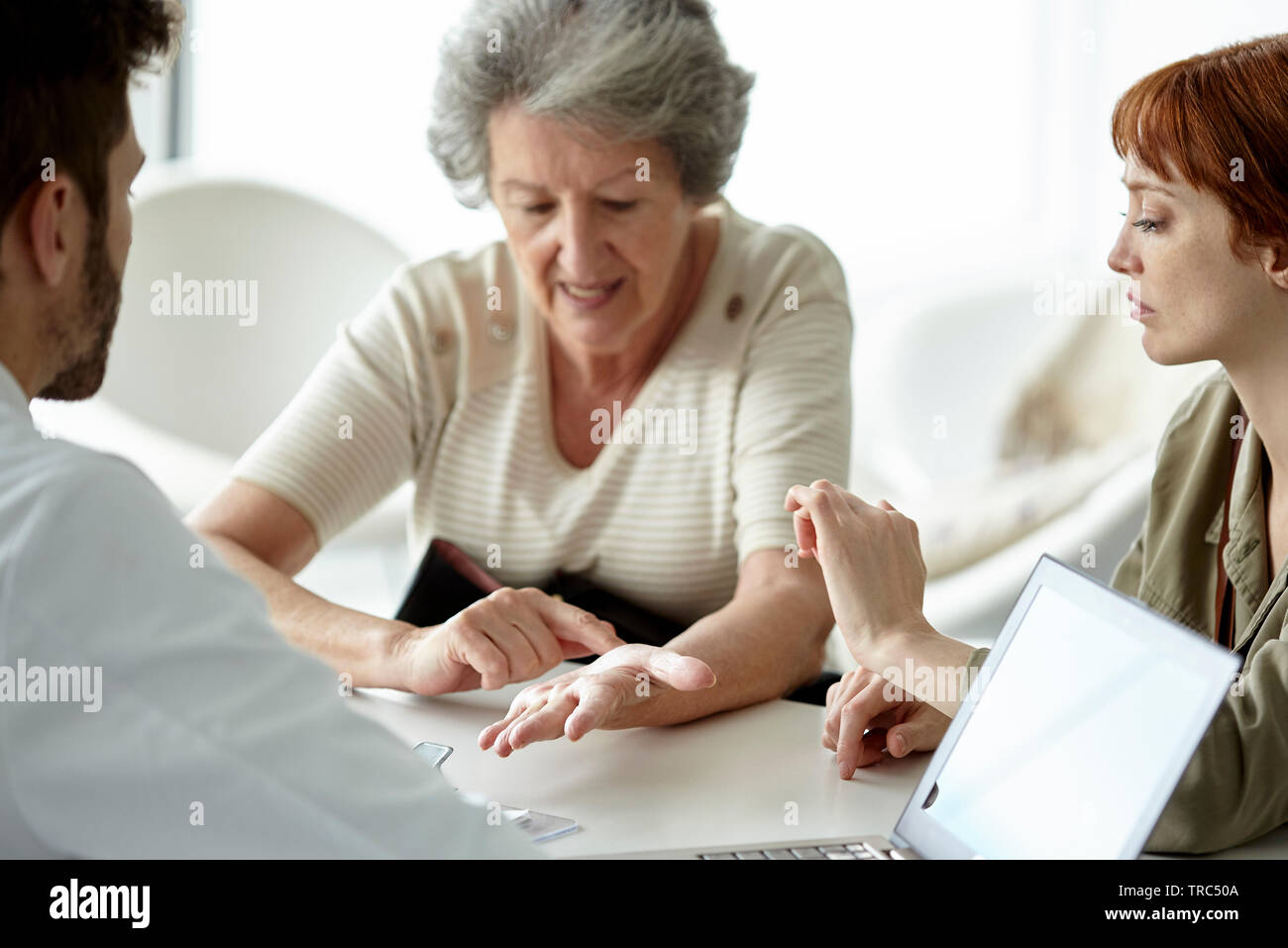 Patient talking with doctor Stock Photo - Alamy