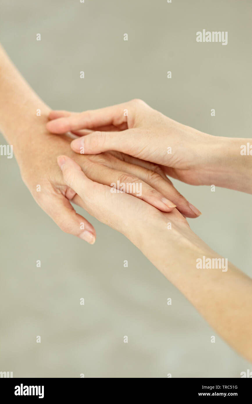 Nurse holding patient's hand Stock Photo - Alamy
