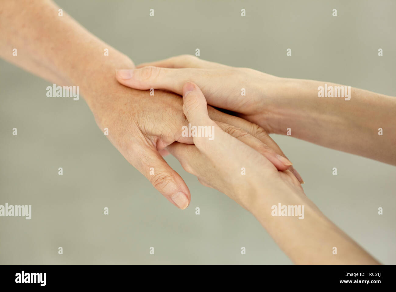 Nurse holding patient's hand Stock Photo - Alamy