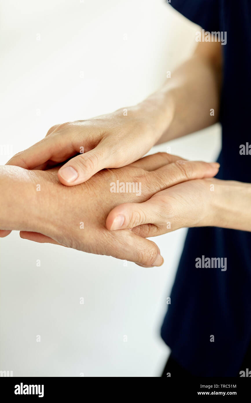 Nurse holding patients hand hi-res stock photography and images - Alamy