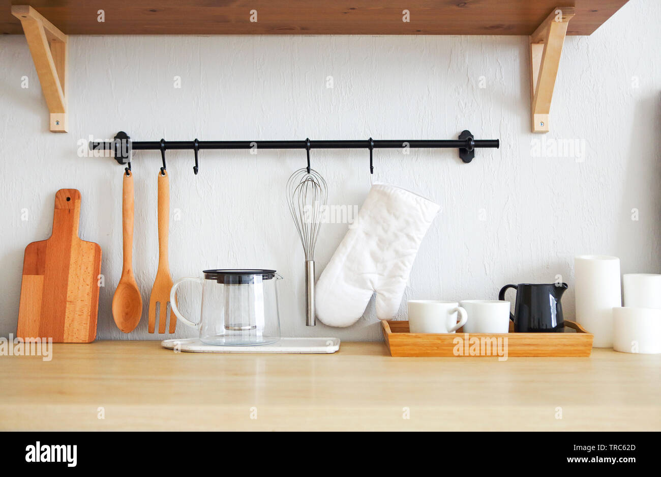Interior of empty modern white kitchen with various objects on the ...