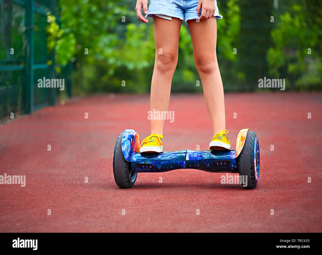 Feet of the little girl riding on a segway. Close up Stock Photo - Alamy