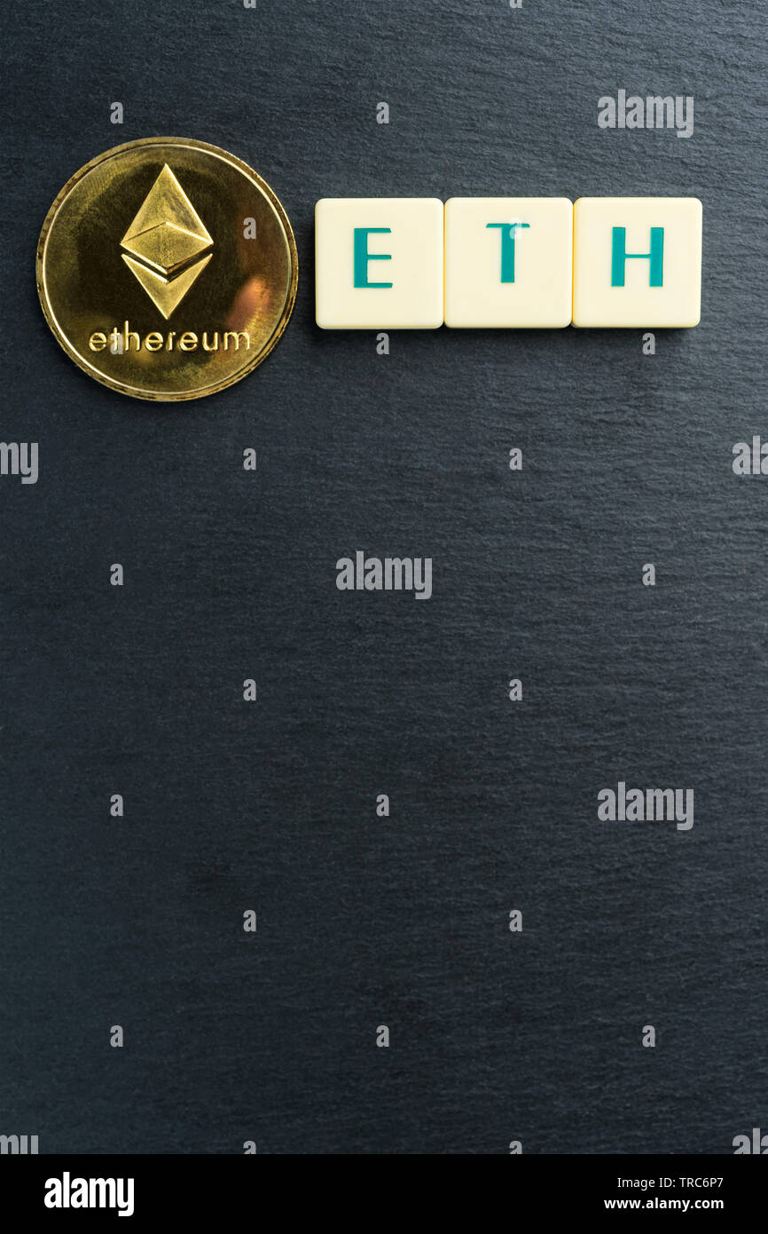 Physical Ethereum gold coin with text made out of letter tiles ...