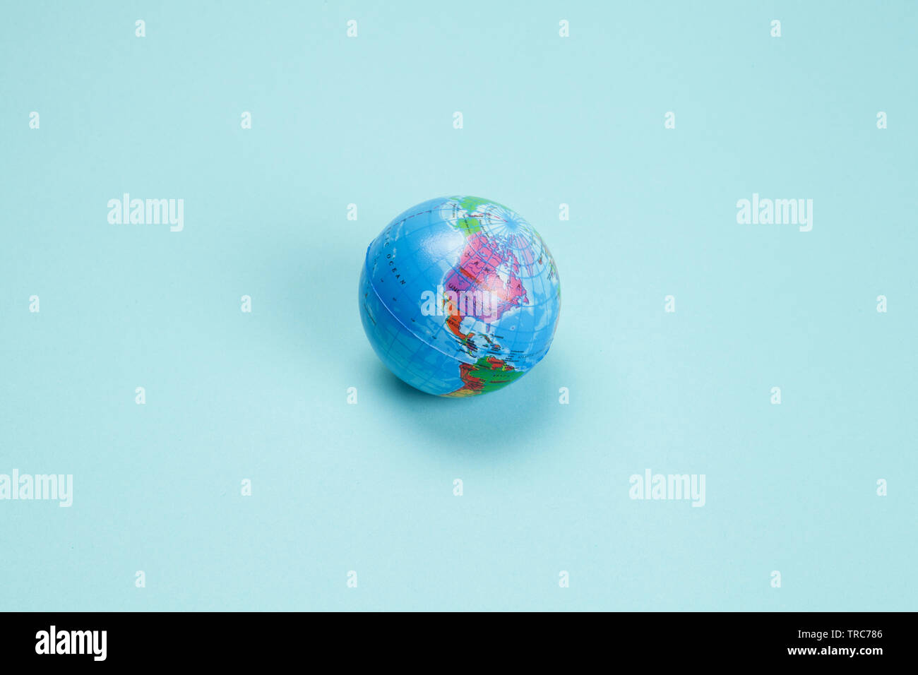 an antistress ball representing the planet earth, isolated on a plain ...